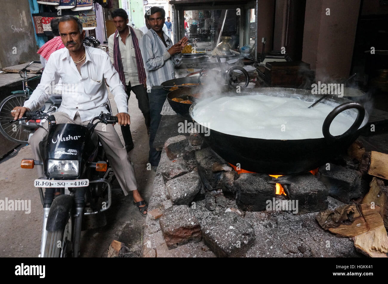 A steaming cooking pot over a fire in an Indian street Stock Photo - Alamy