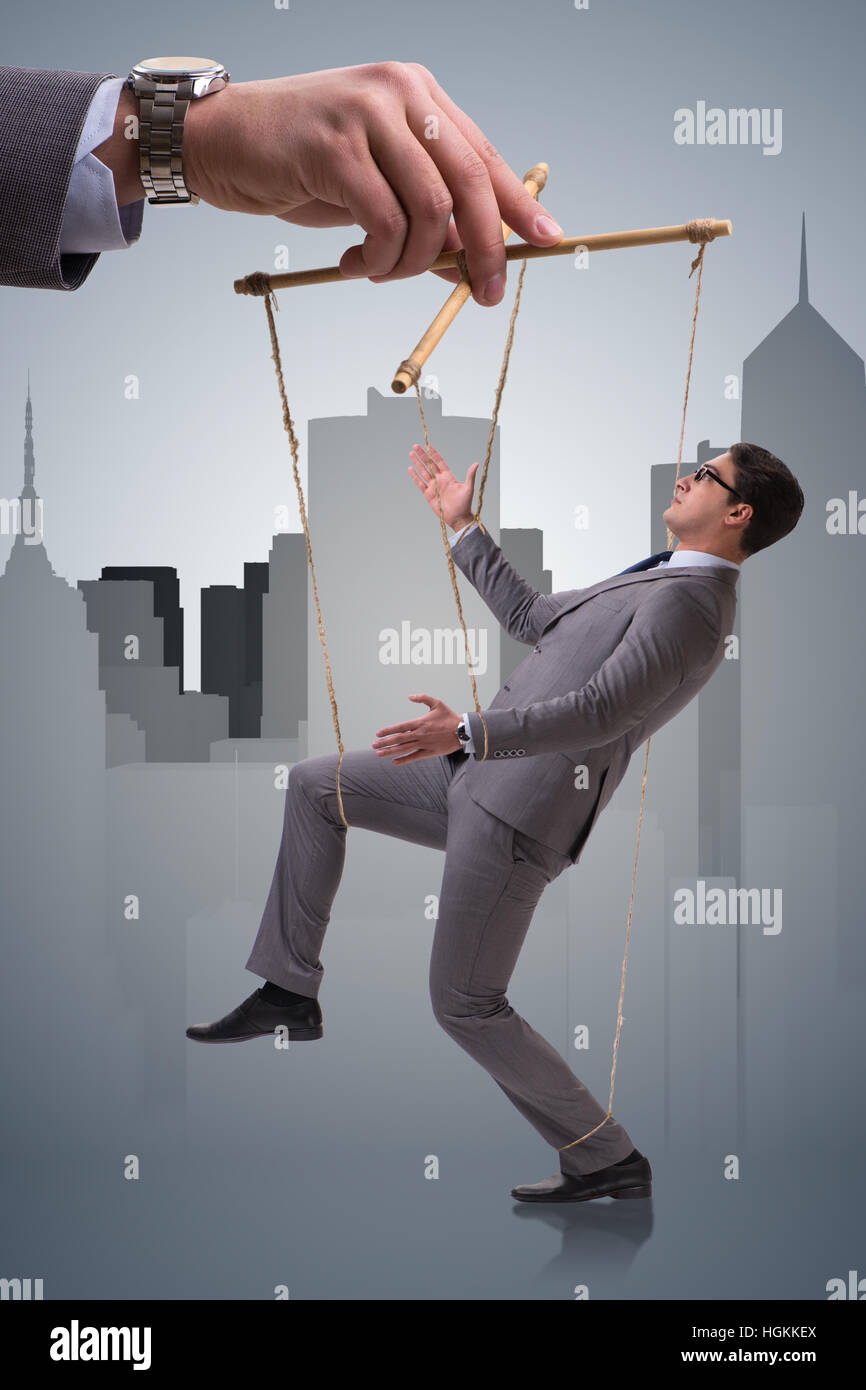 Businessman puppet being manipulated by boss Stock Photo - Alamy
