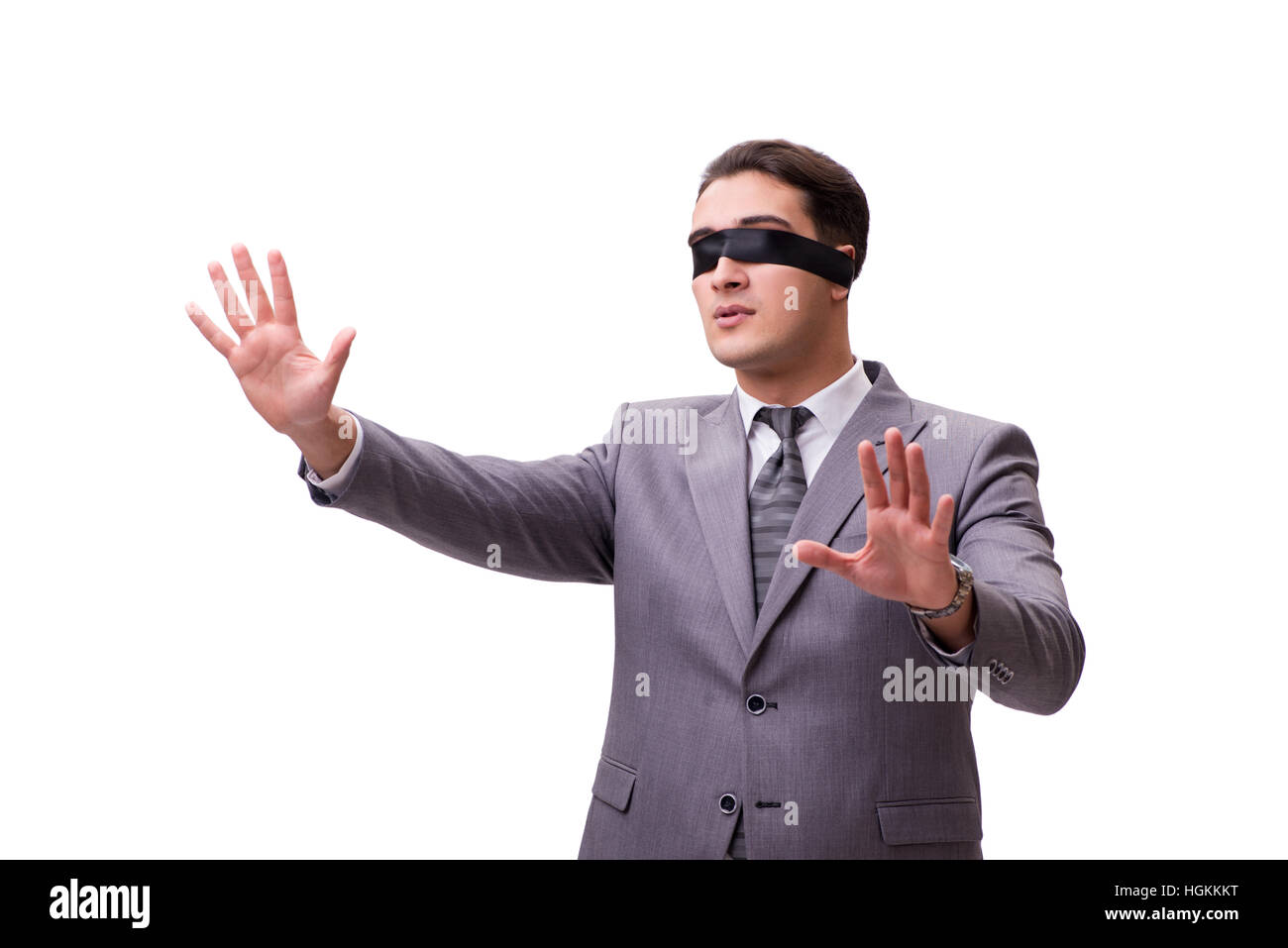 Blindfolded businessman isolated on white Stock Photo - Alamy