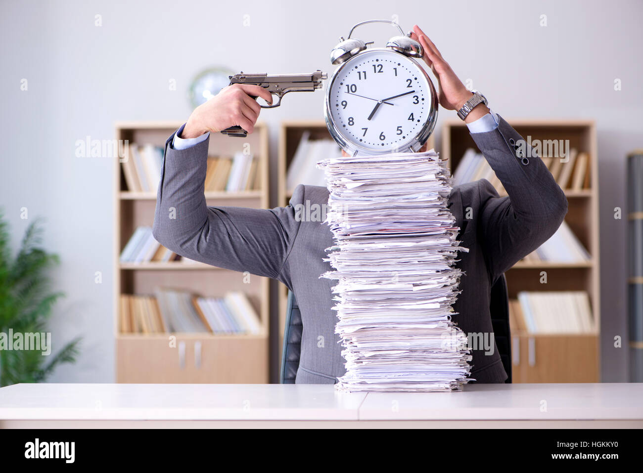 Businessman struggling to meet challenging deadlines Stock Photo - Alamy