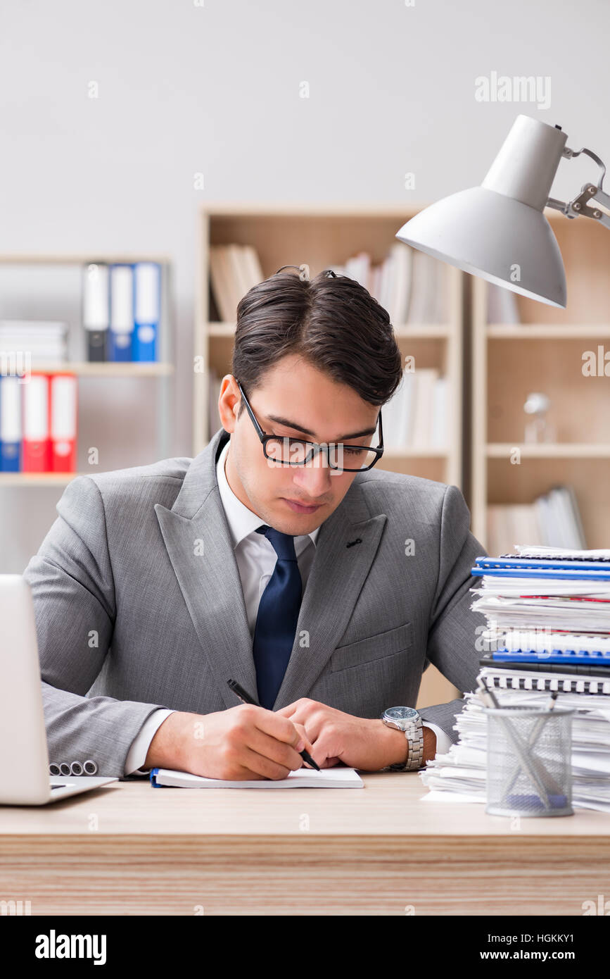 Handsome businessman working in the office Stock Photo - Alamy