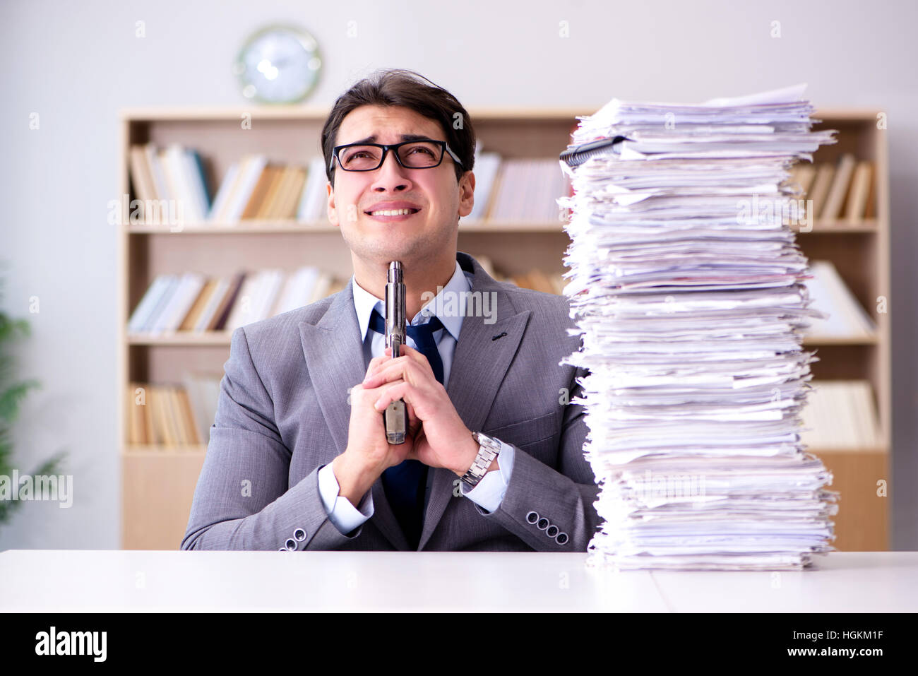 Businessman struggling to meet challenging deadlines Stock Photo - Alamy