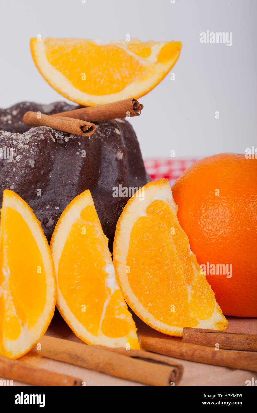 Very tasty chocolate cake with orange on a wooden base Stock Photo - Alamy