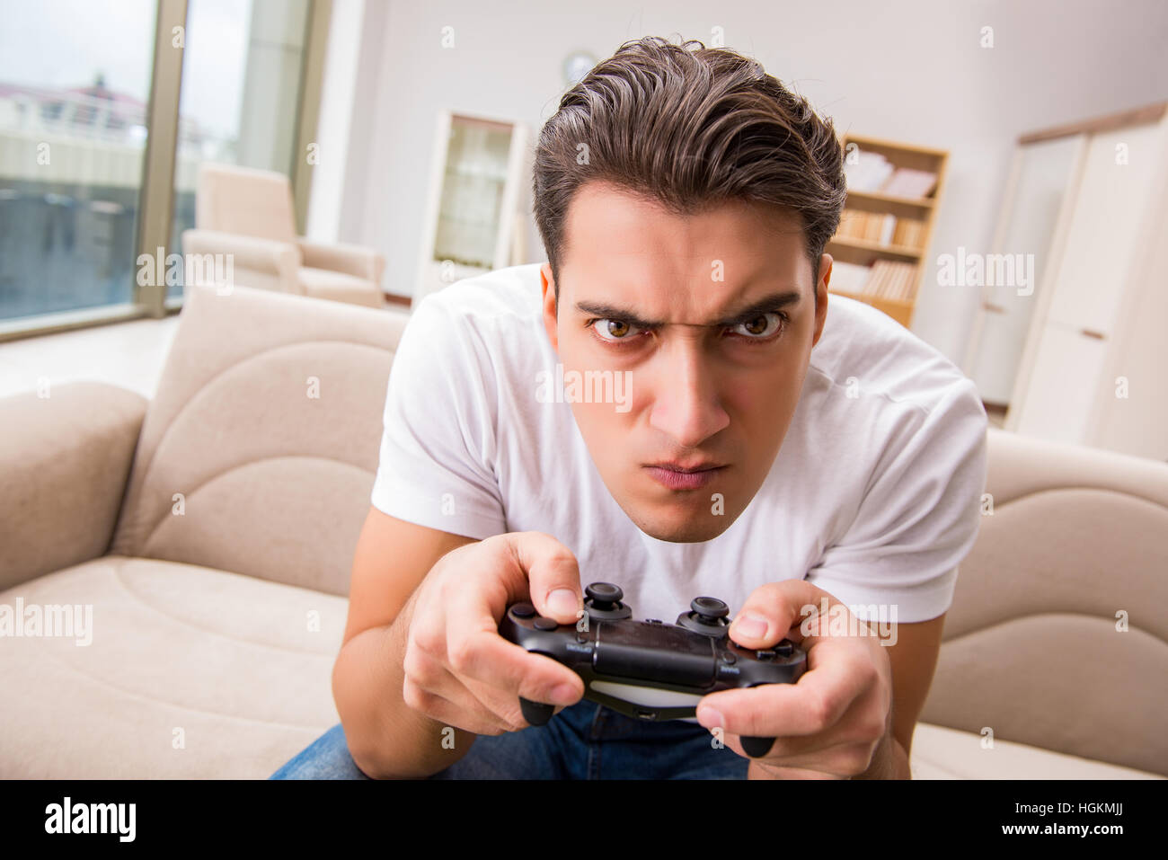 Man addicted to computer games Stock Photo - Alamy