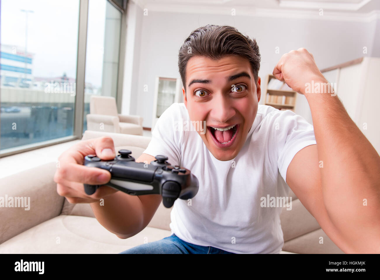 Man addicted to computer games Stock Photo - Alamy