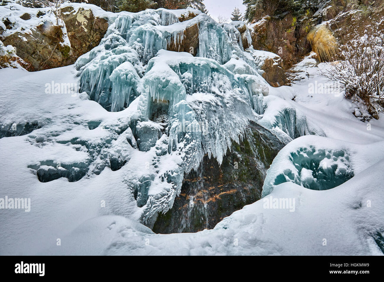 Frozen waterfall in winter time in the mountains Stock Photo - Alamy
