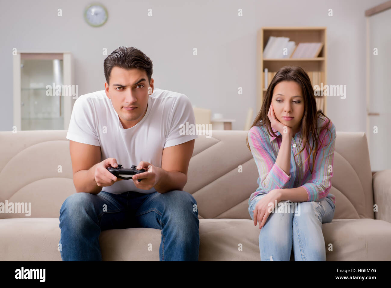 Young family suffering from computer games addiction Stock Photo - Alamy