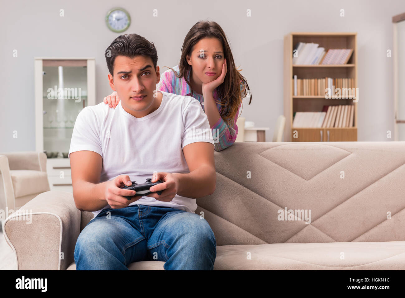 Young family suffering from computer games addiction Stock Photo - Alamy