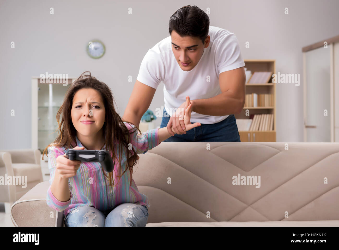 Young family suffering from computer games addiction Stock Photo - Alamy
