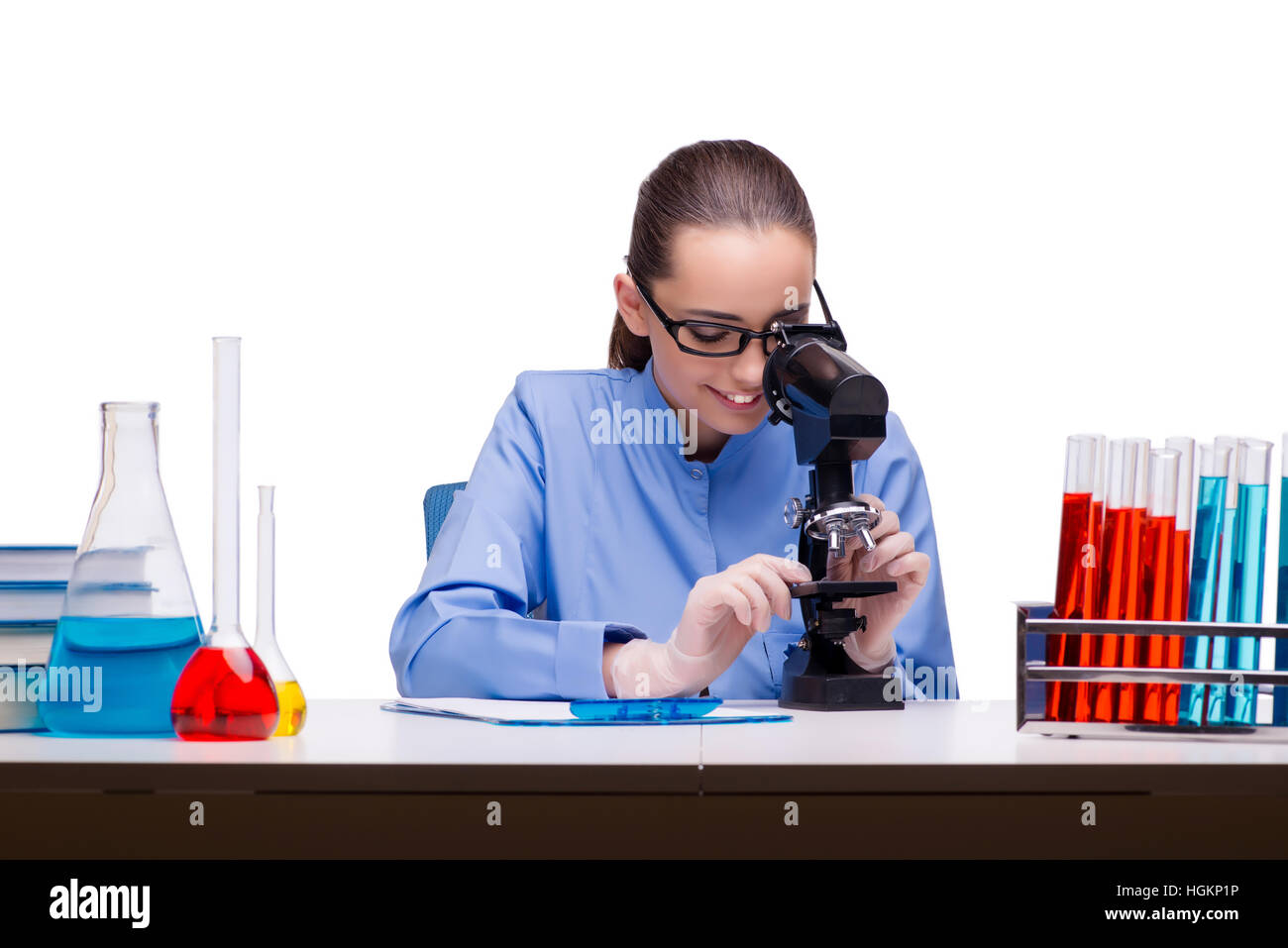 Lab chemist working with microscope and tubes Stock Photo - Alamy