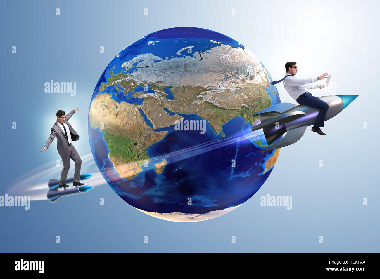Two businessmen chasing around globe Stock Photo - Alamy
