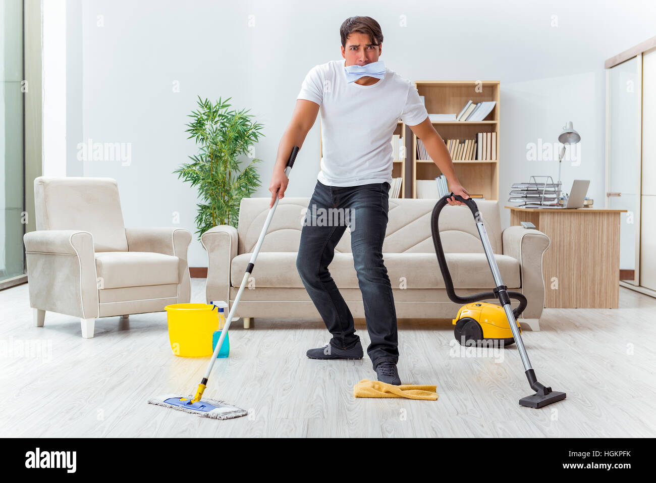 Man husband cleaning the house helping wife Stock Photo - Alamy