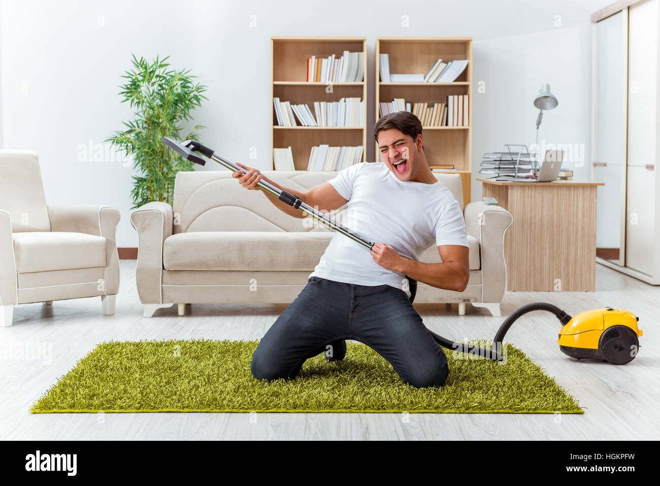 Man husband cleaning the house helping wife Stock Photo - Alamy
