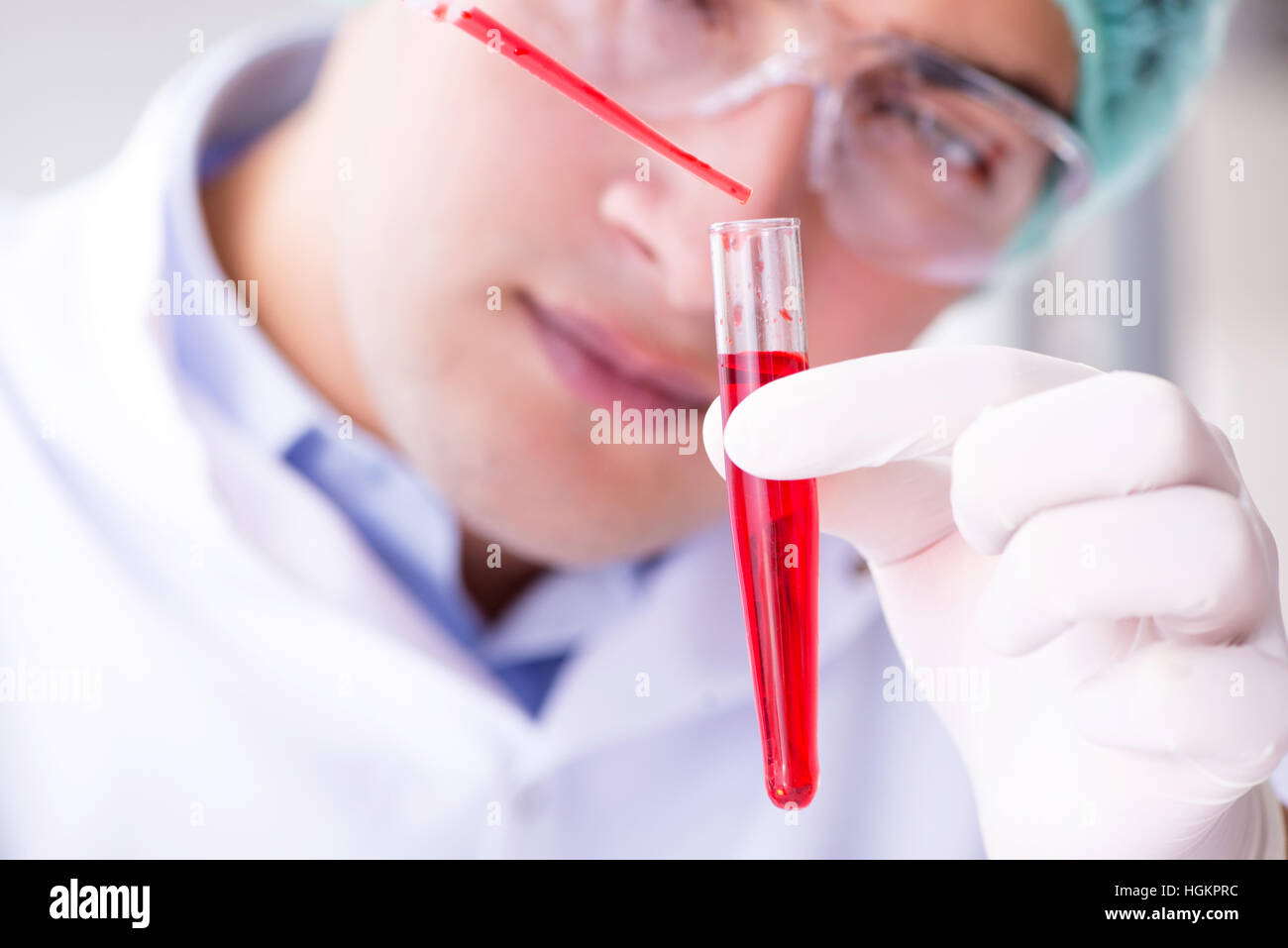 Blood testing in the lab with young scientist Stock Photo - Alamy