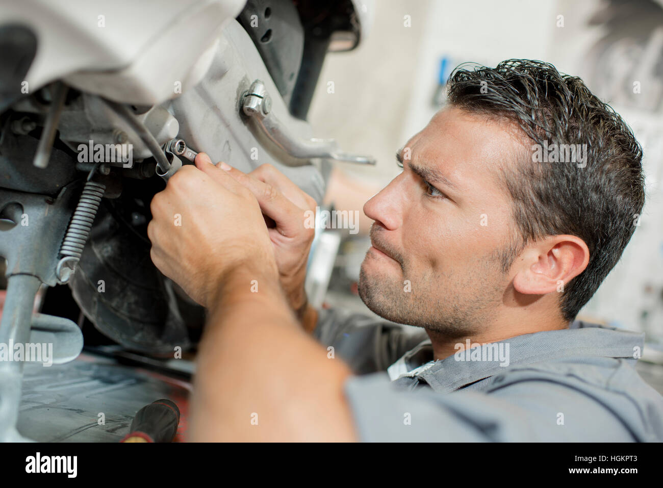 mechanic repairing an engine Stock Photo - Alamy