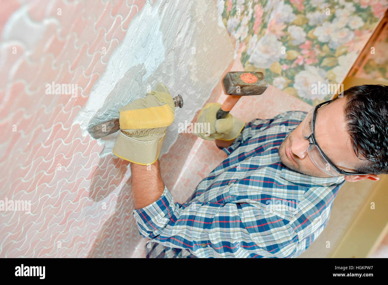 Chiselling of a wall motif Stock Photo - Alamy
