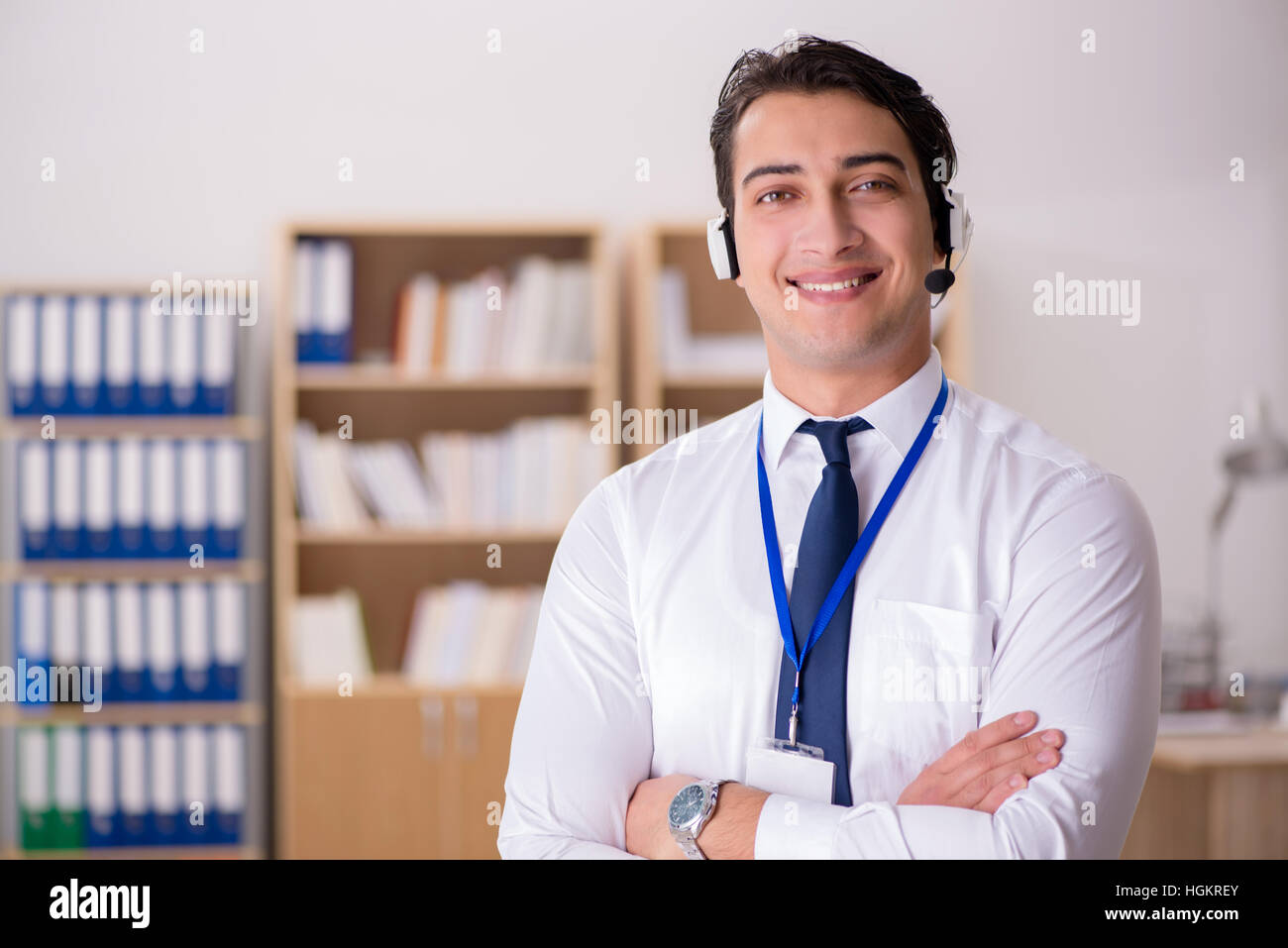 Handsome customer service clerk with headset Stock Photo - Alamy