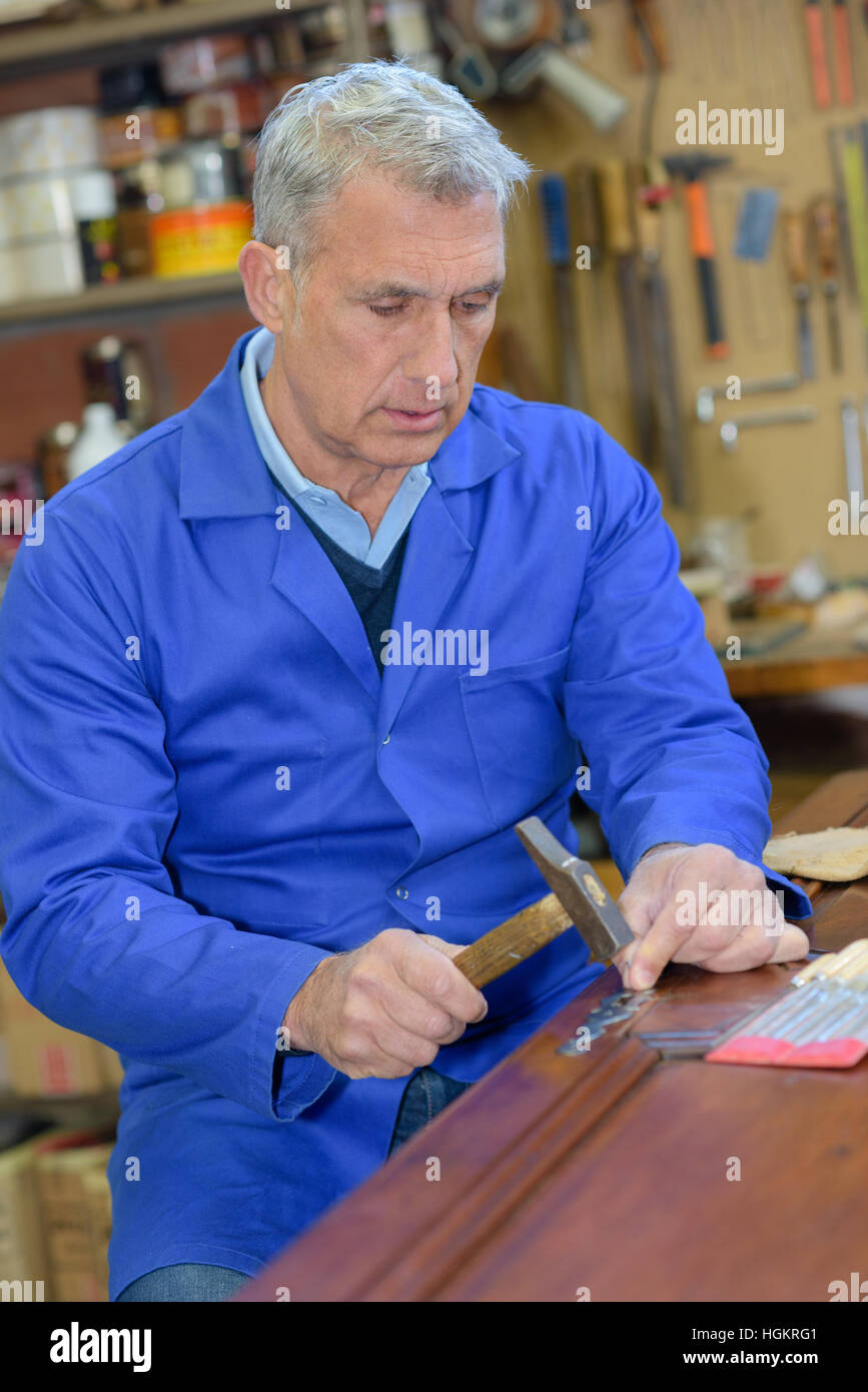 portrait of retired carpenter sitting at his workshop Stock Photo - Alamy