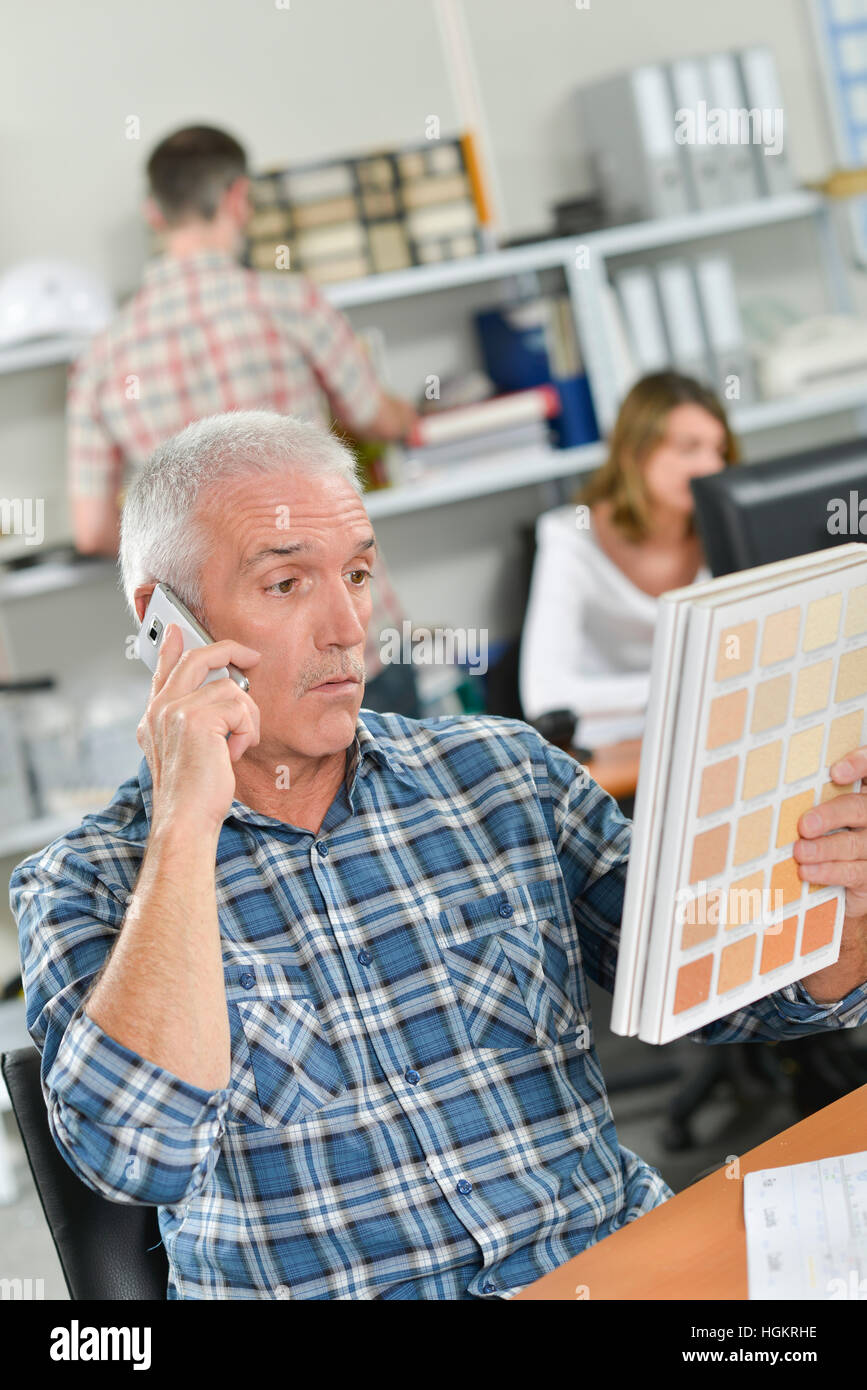 Senior office worker looks confused Stock Photo - Alamy