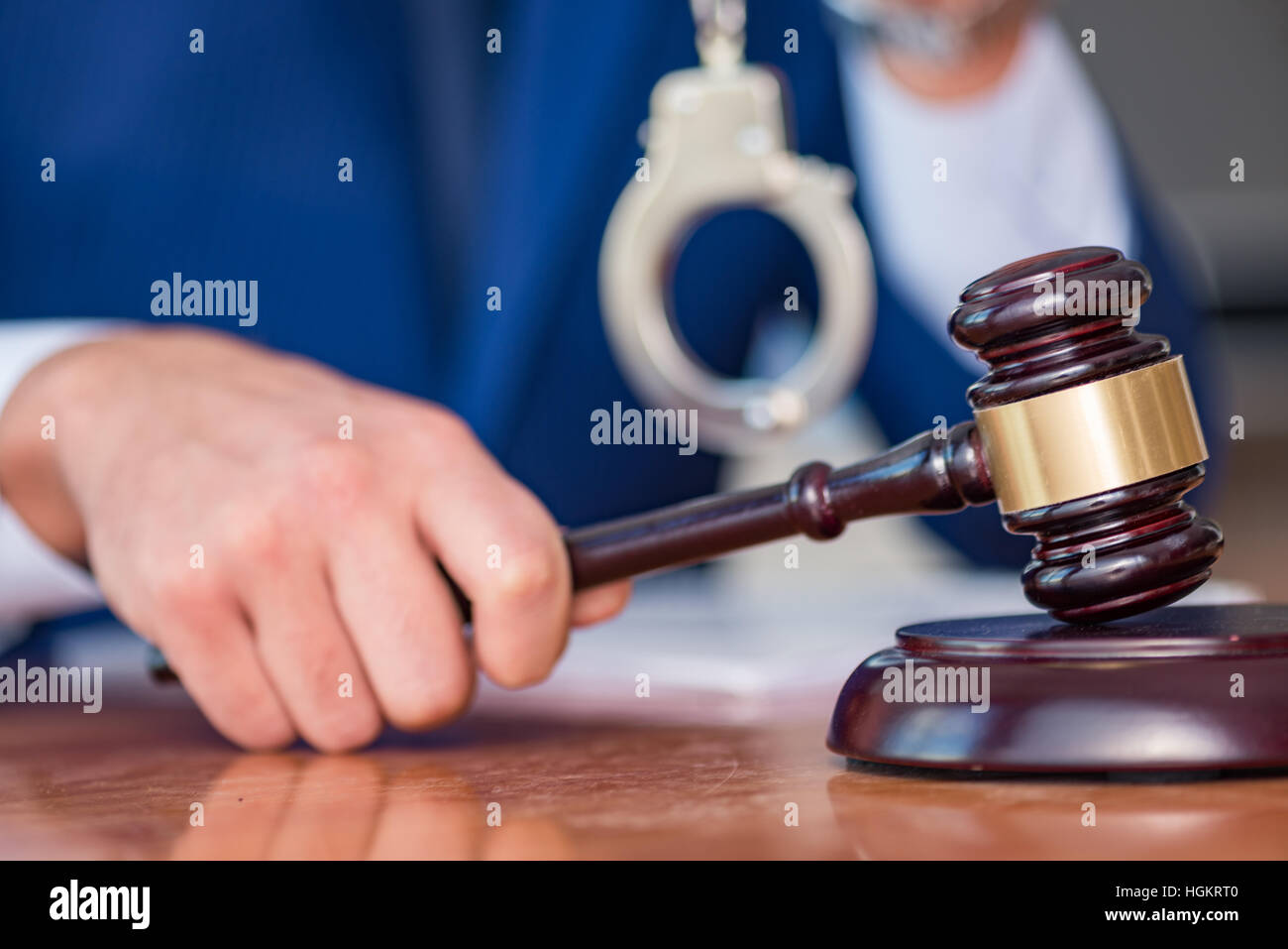 Handsome judge with gavel sitting in courtroom Stock Photo - Alamy