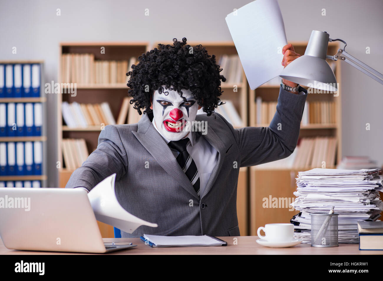 Clown businessman working in the office Stock Photo - Alamy