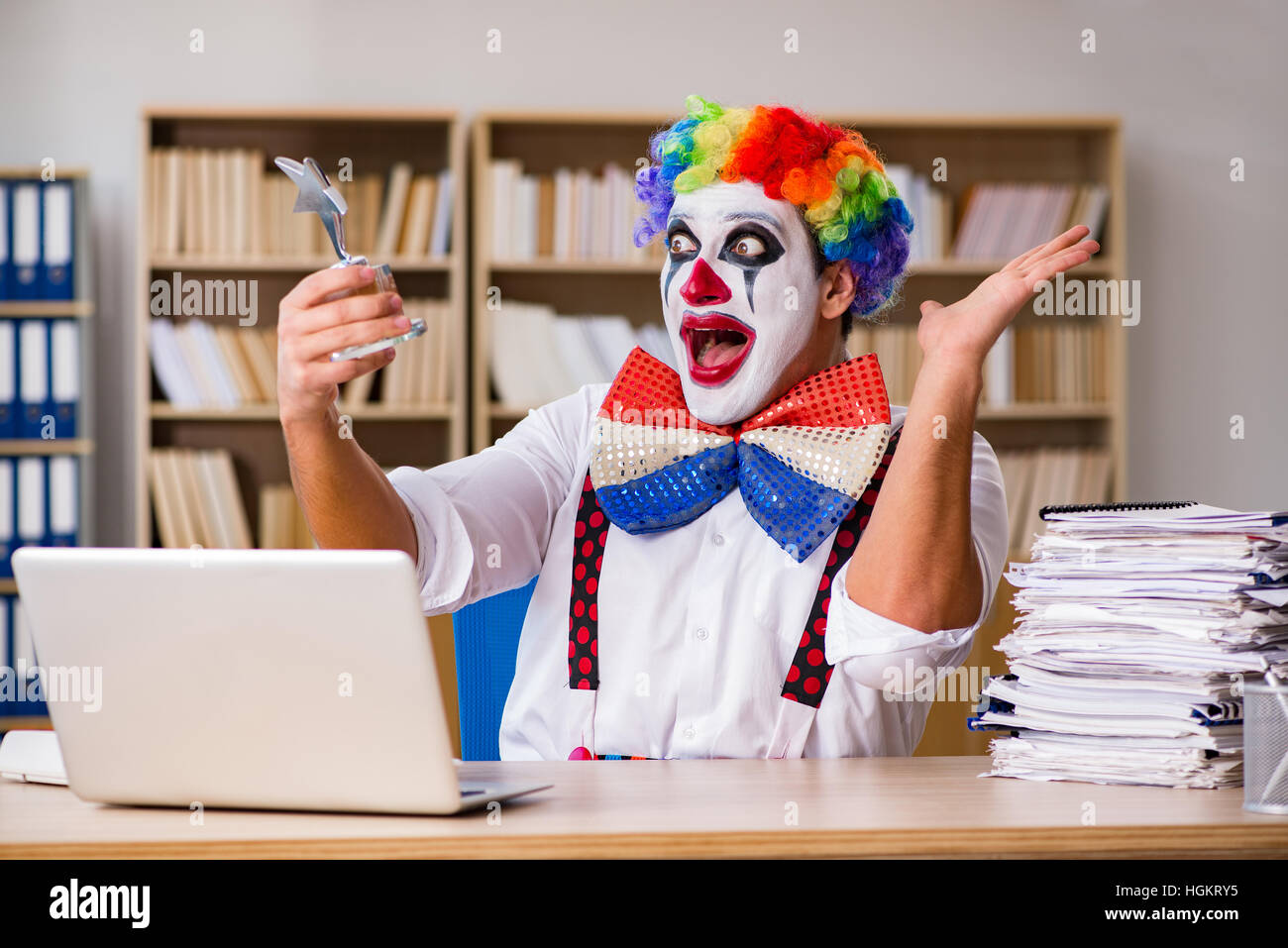 Clown businessman working in the office Stock Photo - Alamy