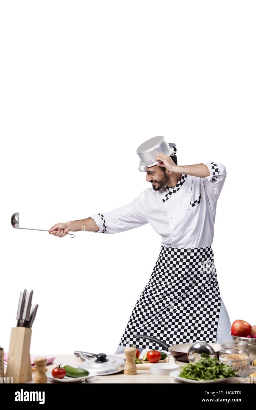 Funny male cook isolated on the white background Stock Photo - Alamy
