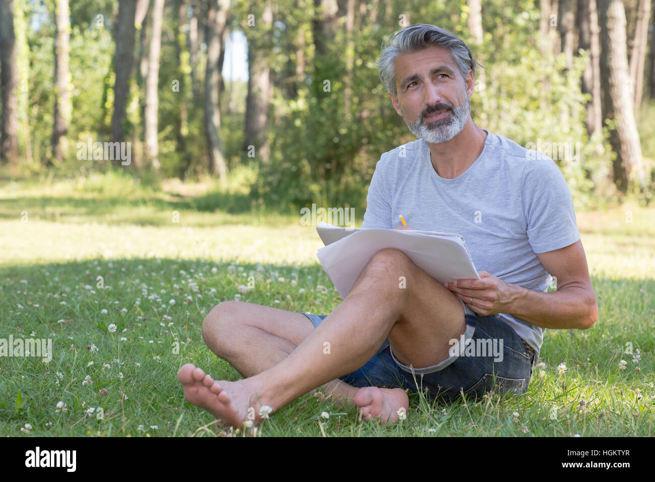 handsome man painting a spring landscape Stock Photo - Alamy