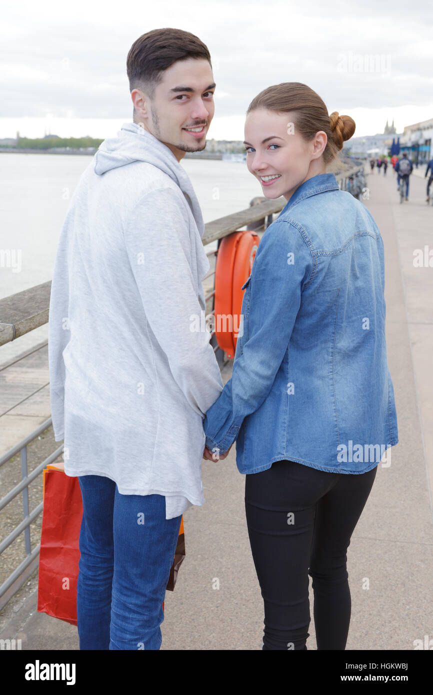 couple holding hands and walking on the quais Stock Photo - Alamy