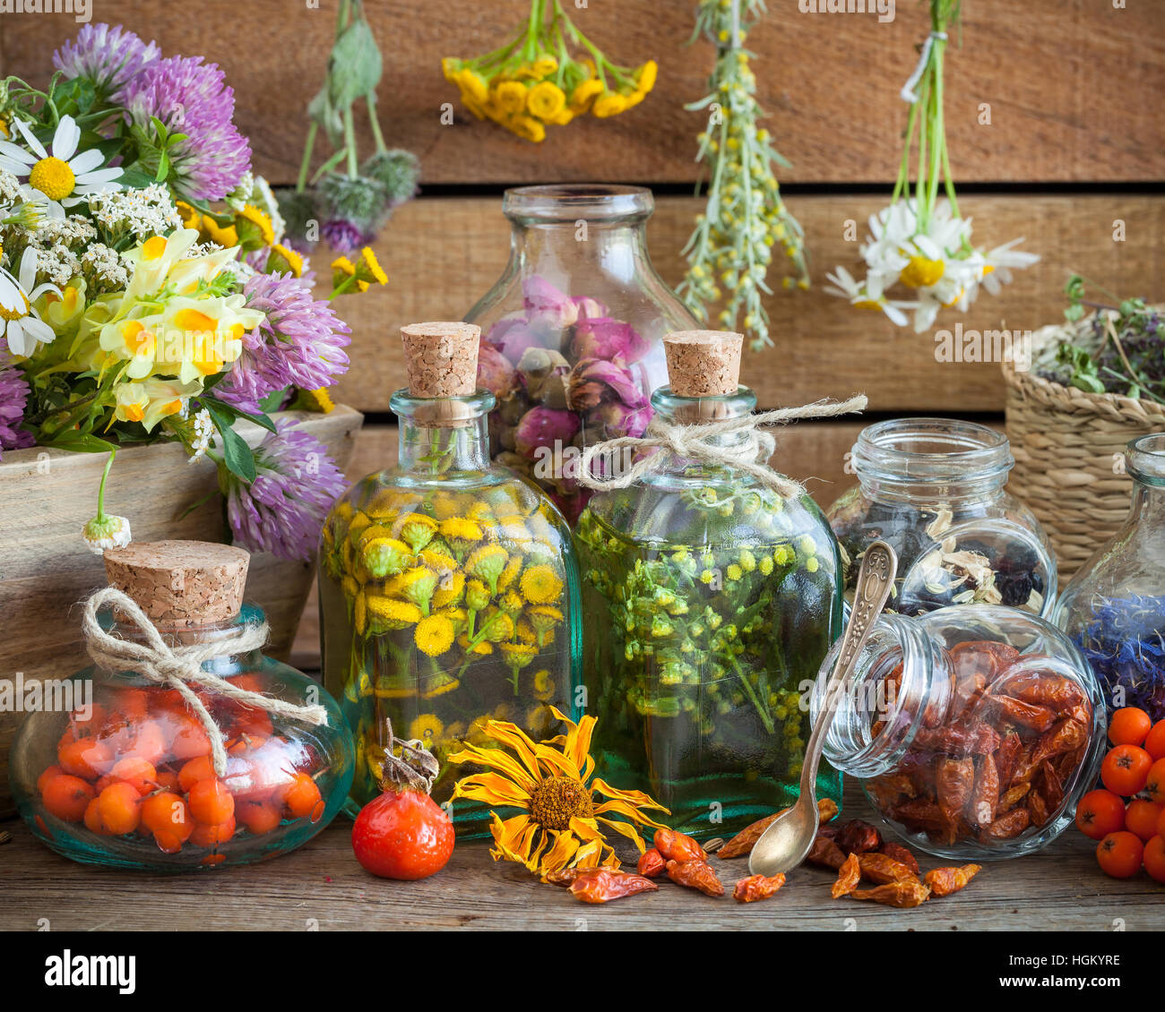 Bottles of tincture and healthy herbs, healing herbs in wooden box ...