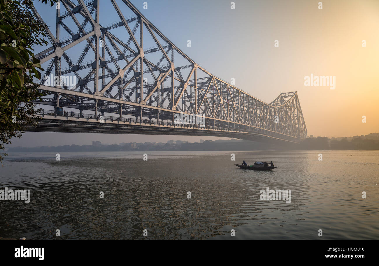 Historic Howrah bridge on river Ganges on a misty winter morning with a ...