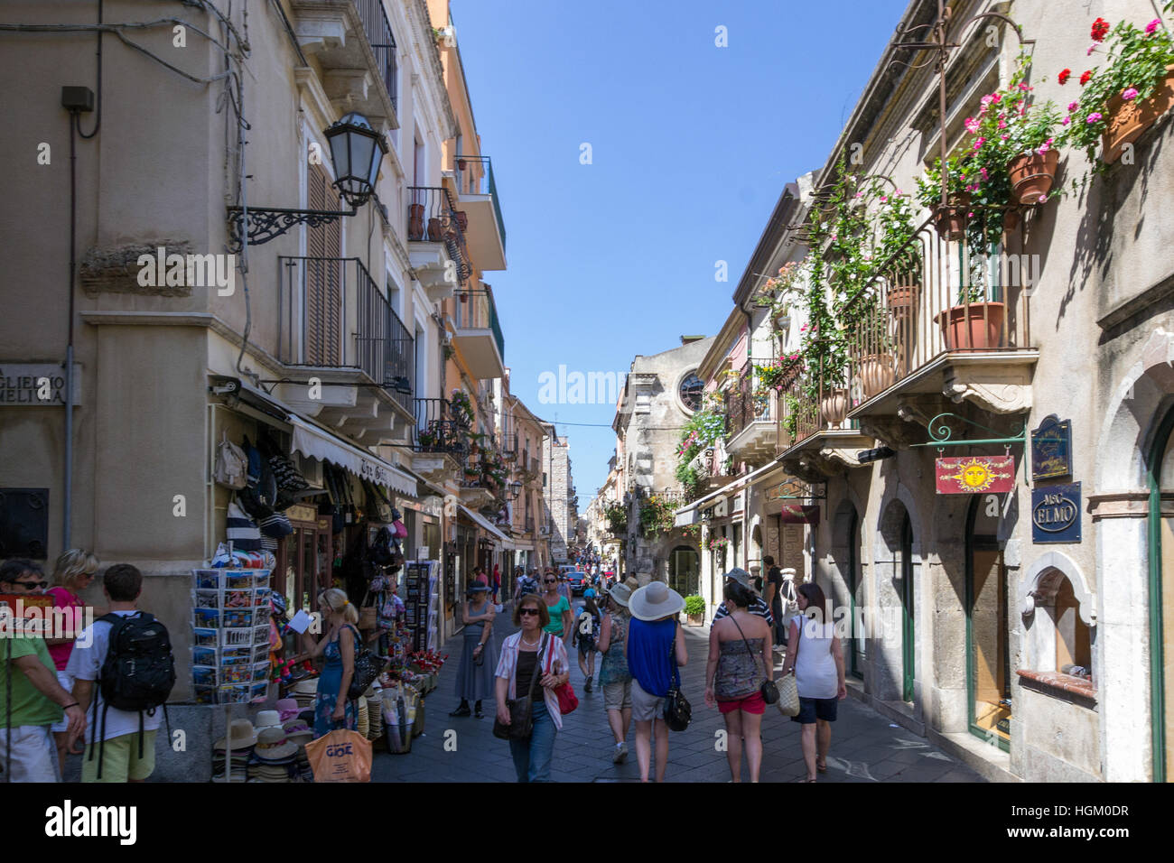 Tourists walking down an Italian street Stock Photo - Alamy