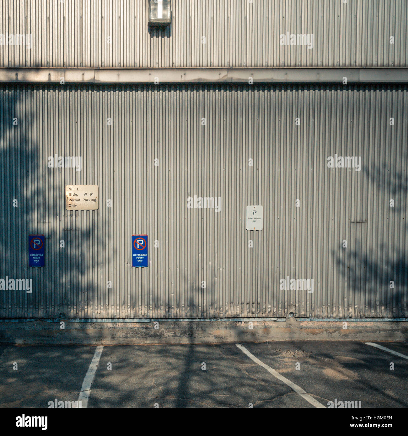 parking in front of a metal wall Stock Photo - Alamy