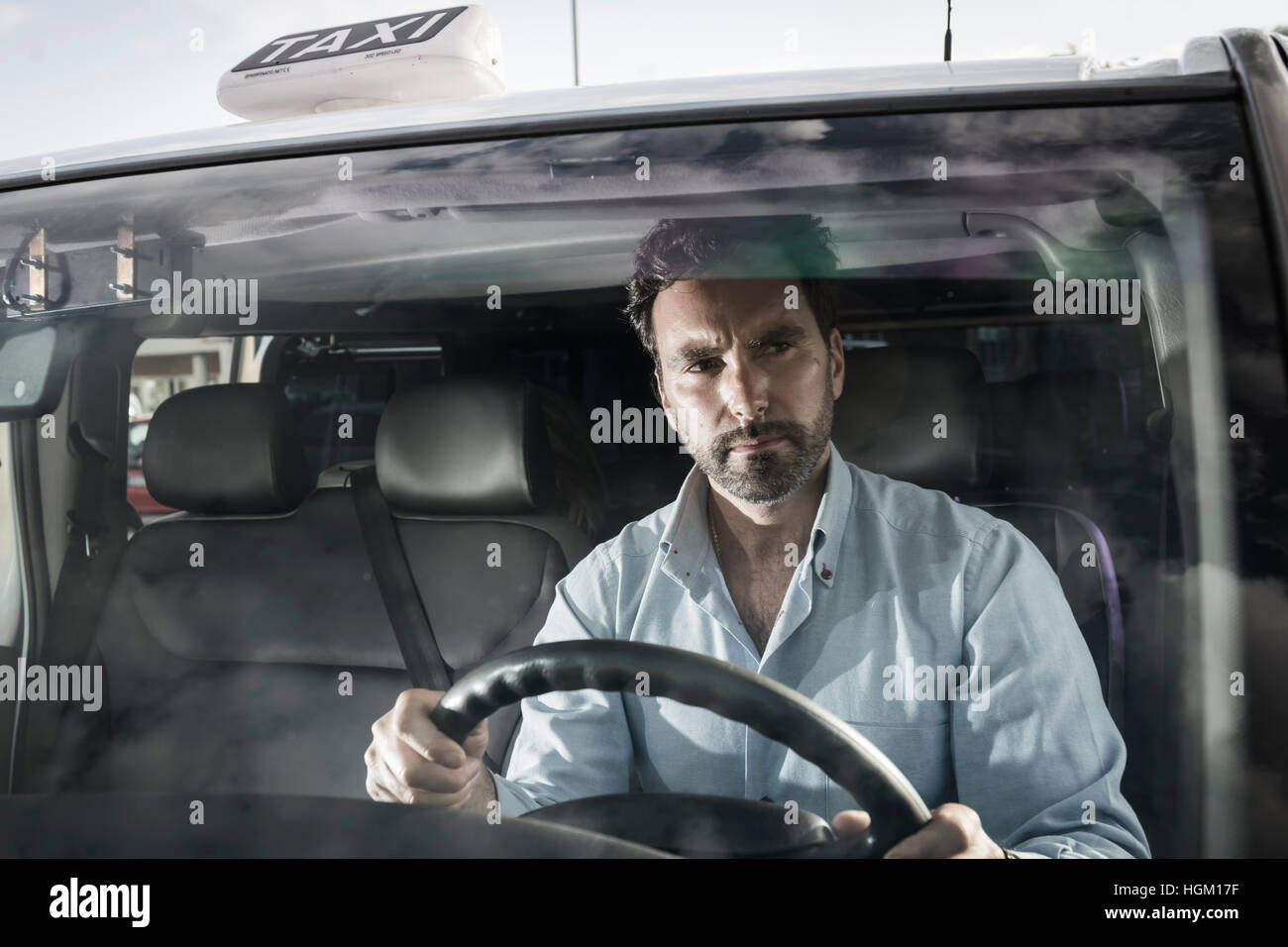 Portrait of a taxi driver Stock Photo - Alamy
