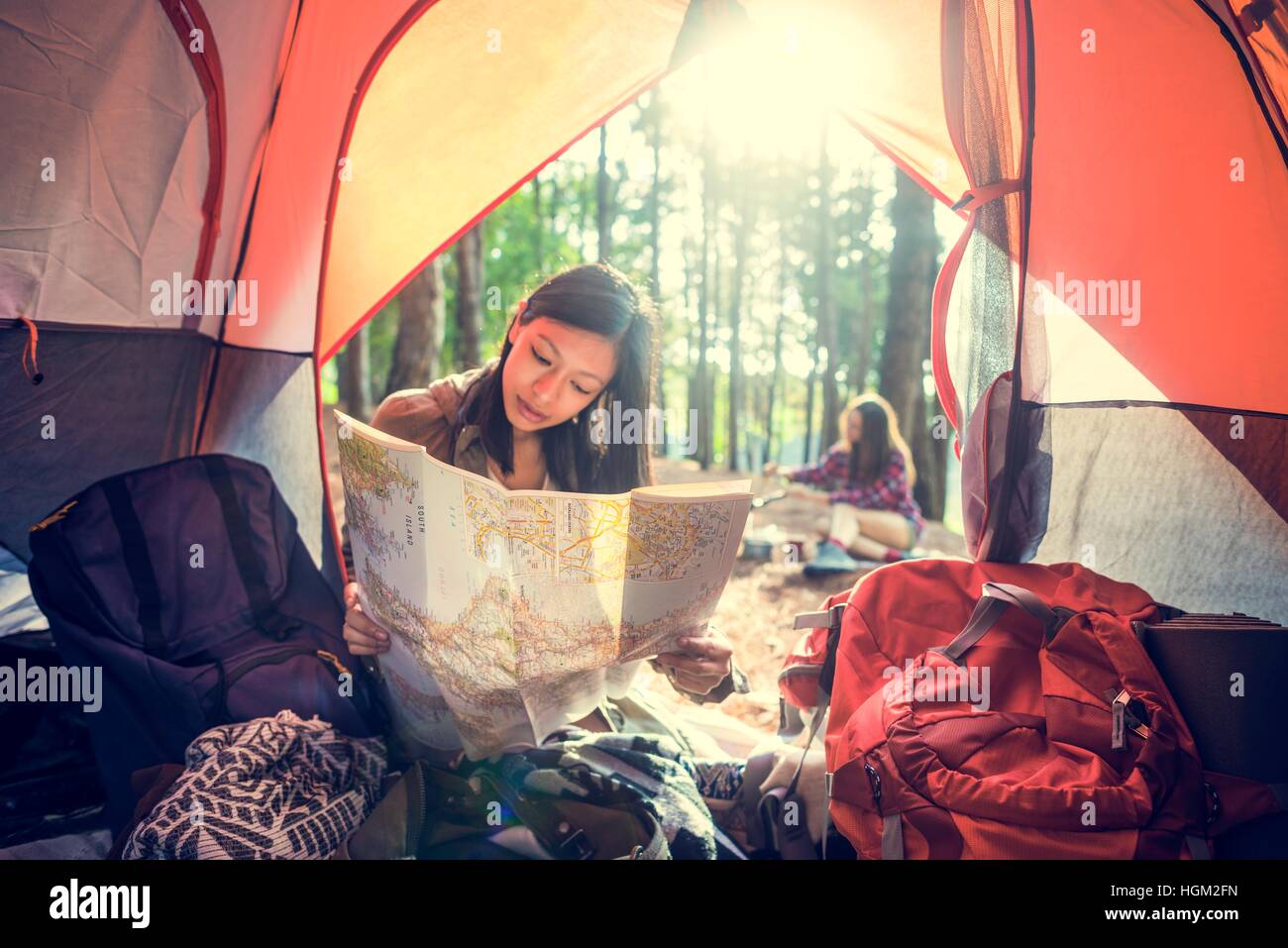 Girl Reading Map Traveling Destination Camping Concept Stock Photo - Alamy