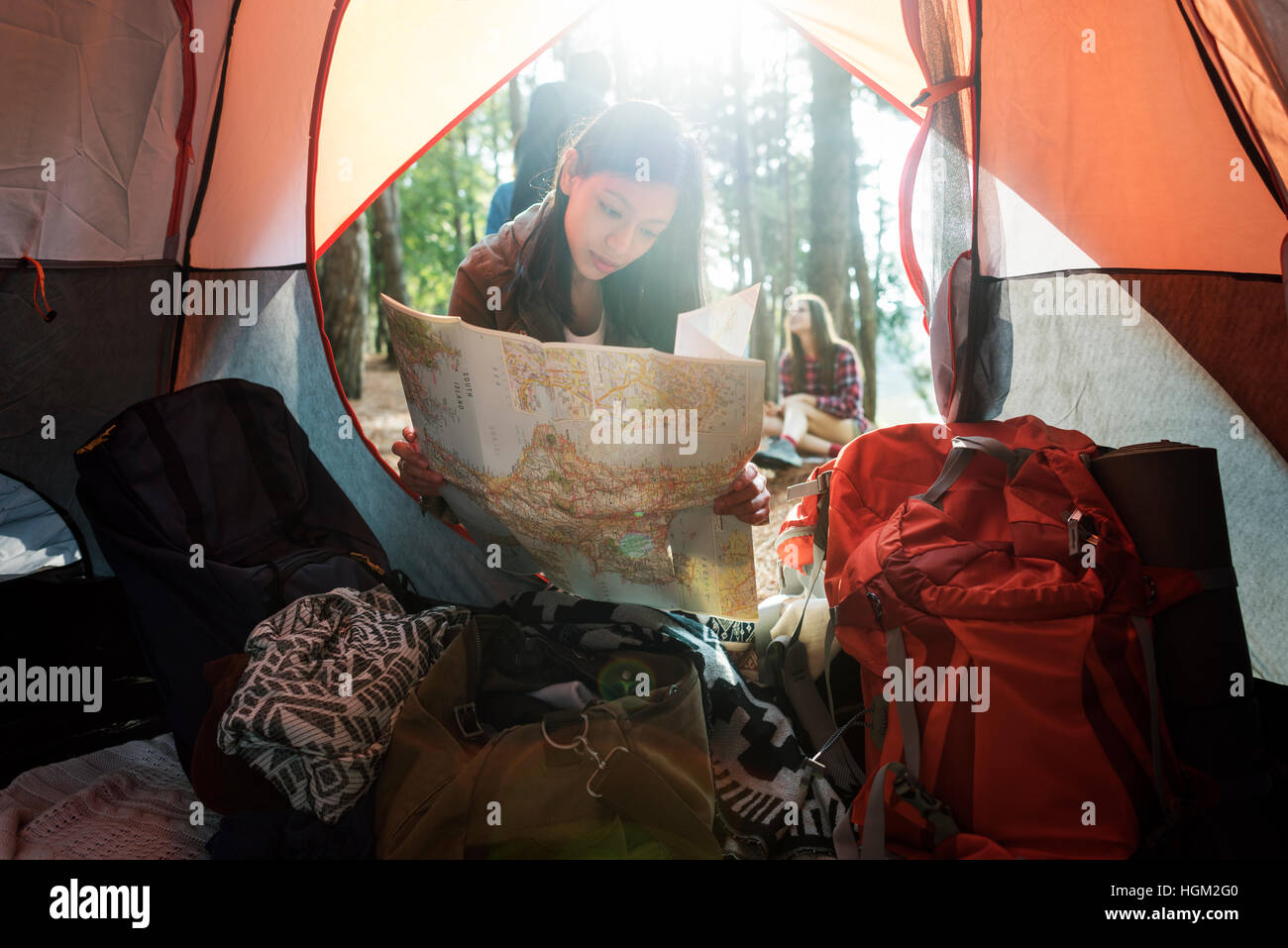 Girl Reading Map Traveling Destination Camping Concept Stock Photo - Alamy