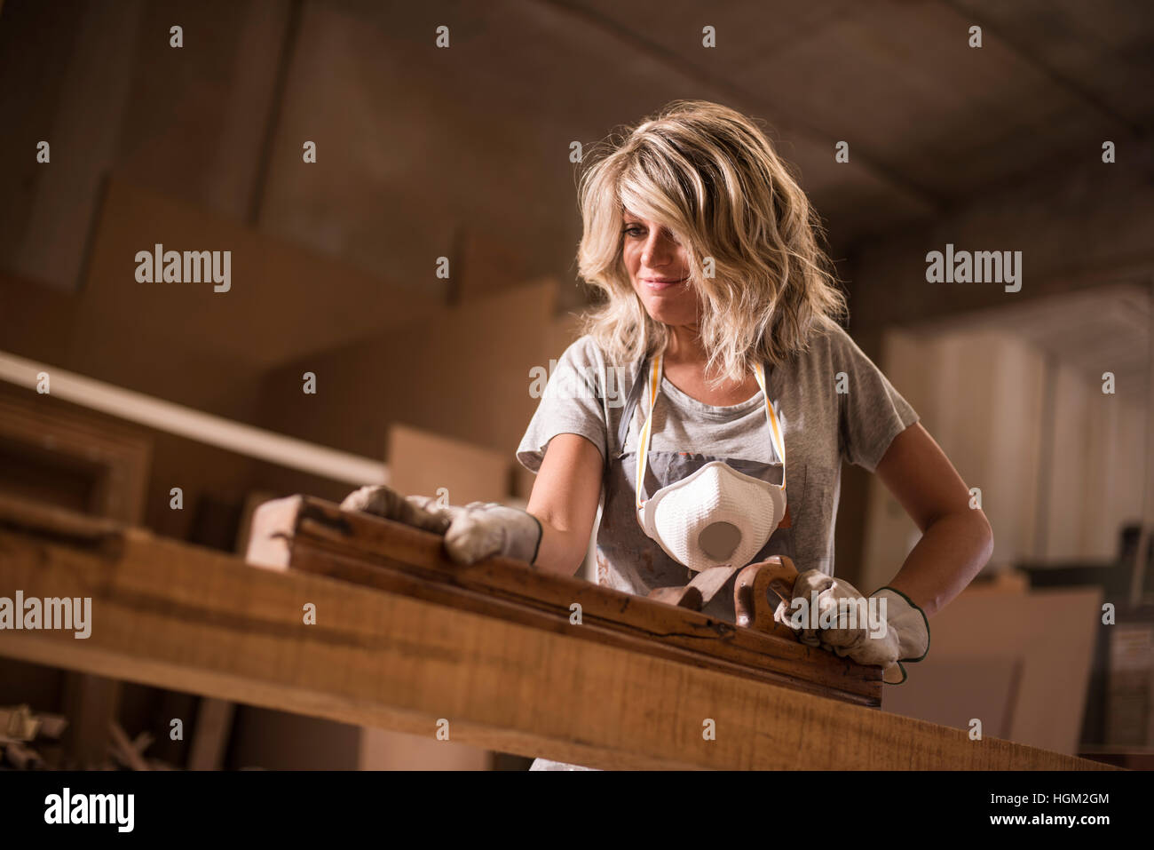 Young female carpenter at work Stock Photo - Alamy