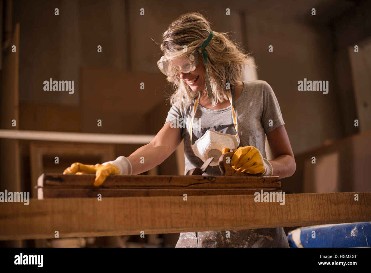 Young female carpenter at work Stock Photo - Alamy