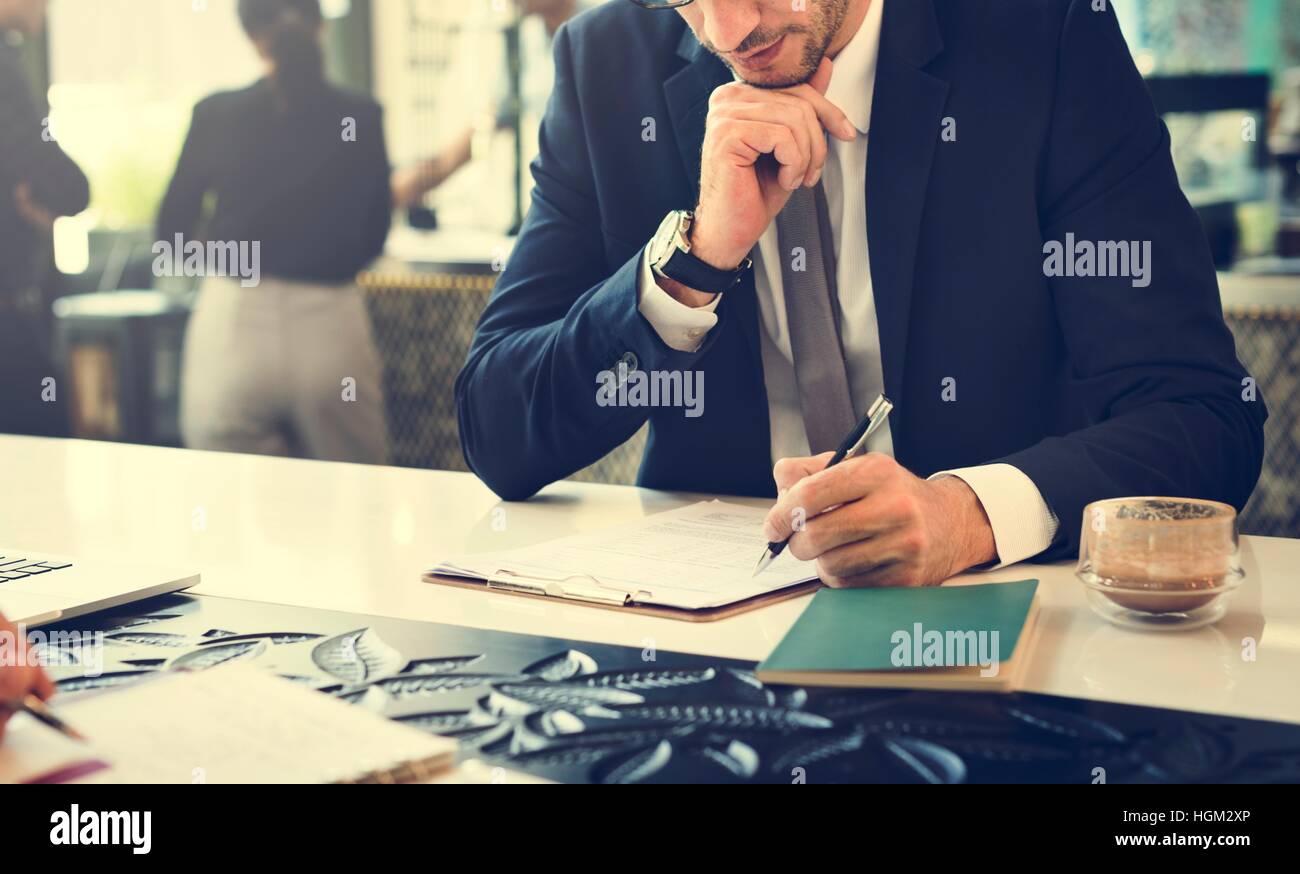 Serious Business Man Filling Out Form Concept Stock Photo - Alamy