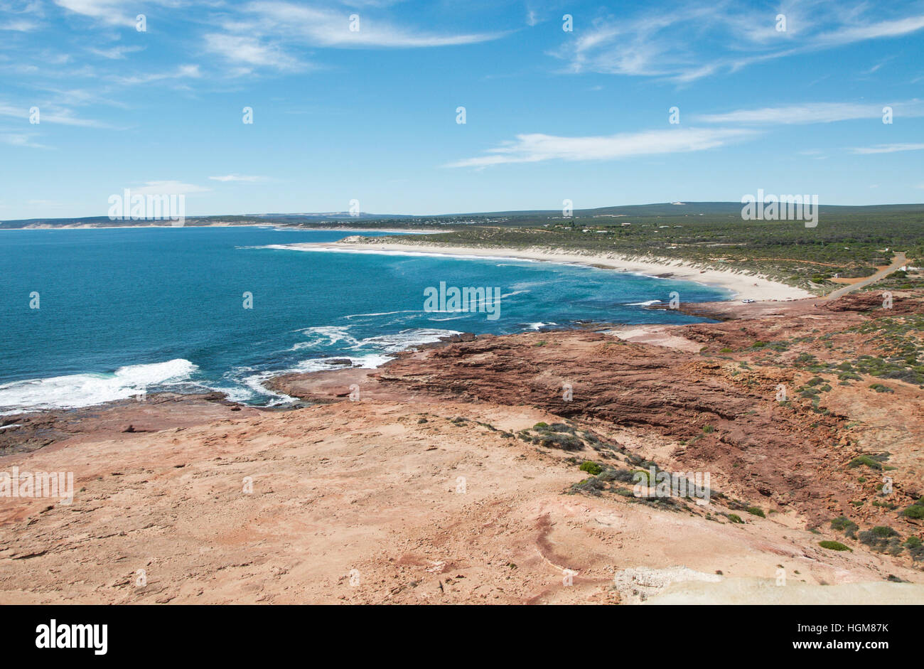 Rugged sandstone formations at Red Bluff with a turquoise Indian Ocean ...