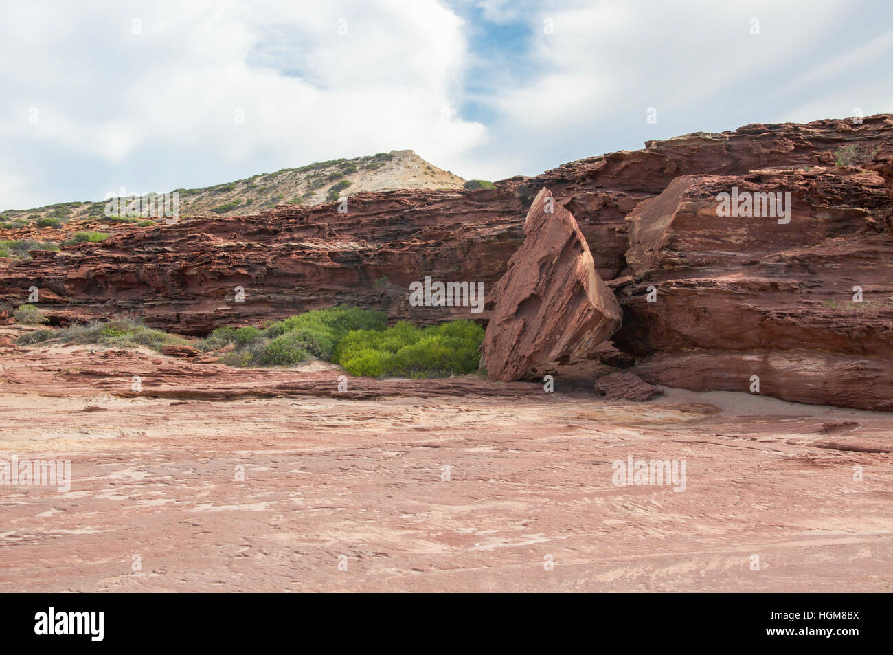 Unique red sandstone rock formations along Red Bluff beach in remote ...