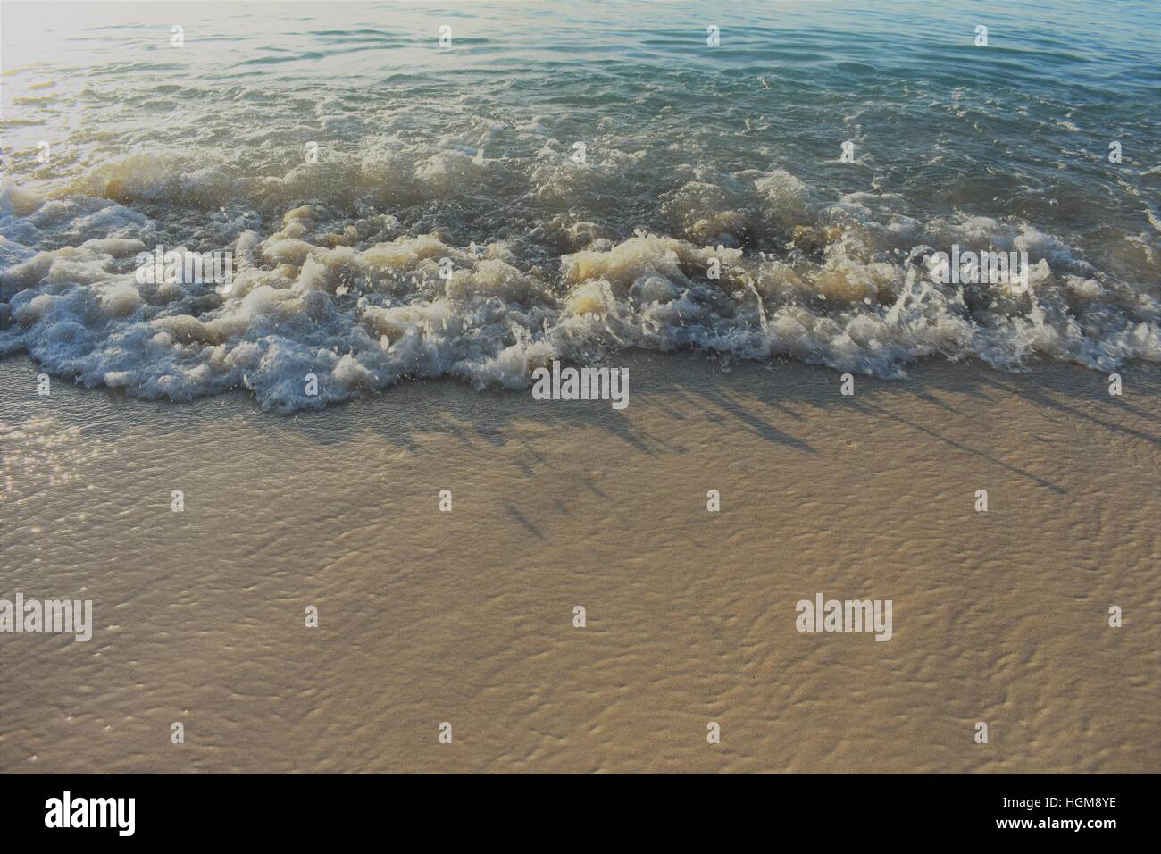 waves lapping beach Stock Photo - Alamy