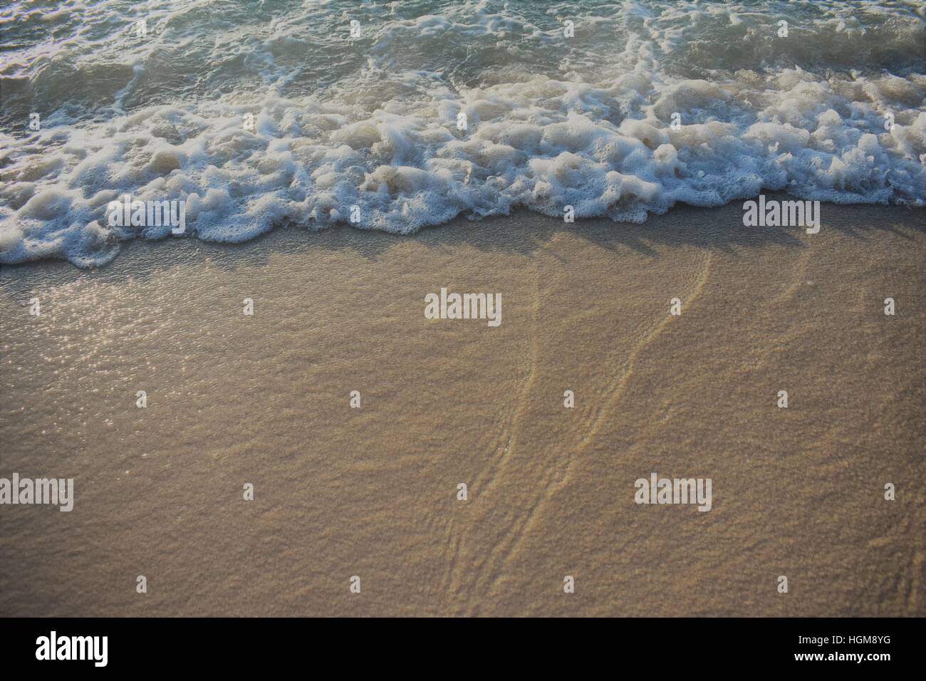 waves lapping beach Stock Photo - Alamy