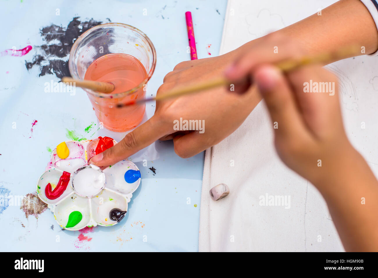 Mixing Water Colors in a painting Class Stock Photo - Alamy