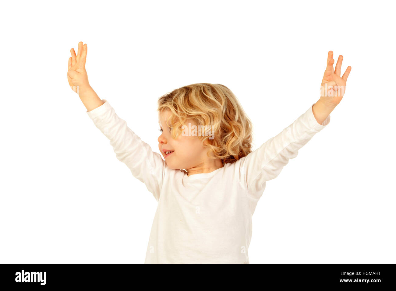 Small blond child raising his arms isolated on a white background Stock ...