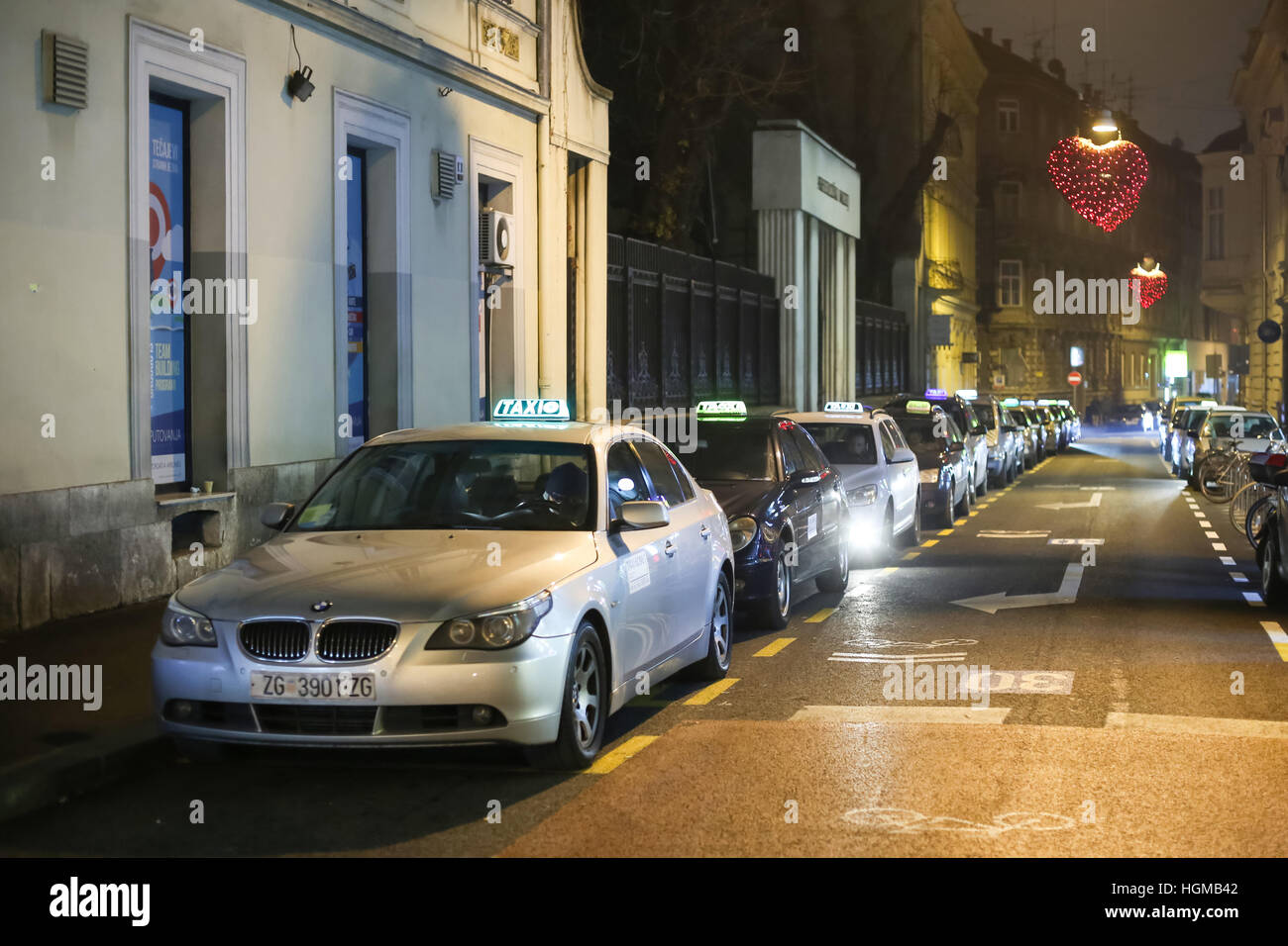 Taxi station with lined up taxi cars in the decorated Gajeva street in ...