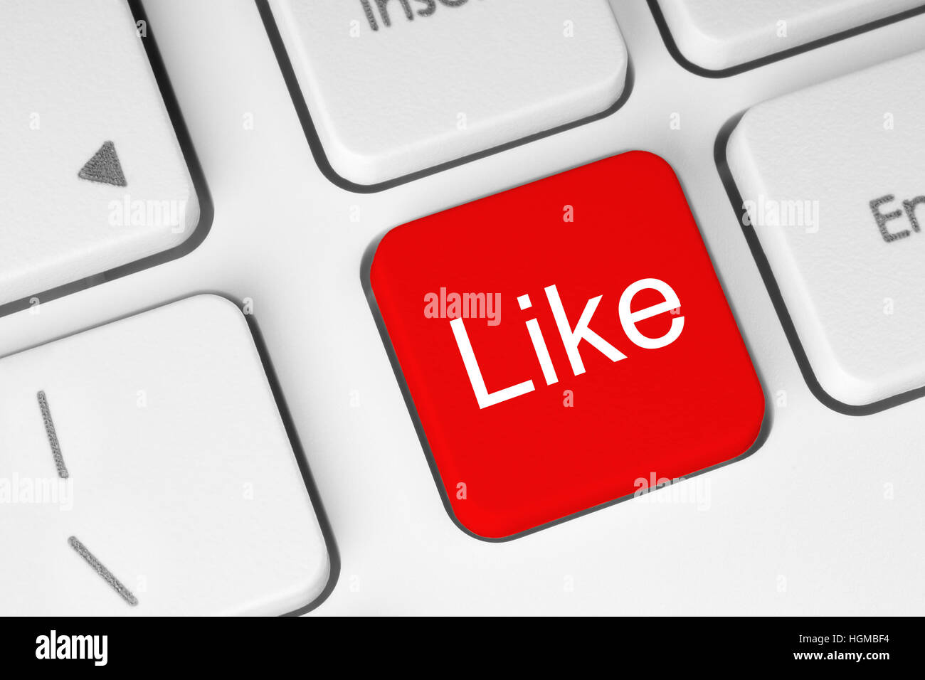 Red like button on keyboard close-up Stock Photo - Alamy