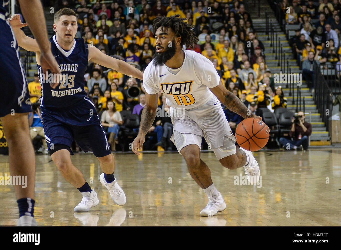 Virginia, USA. 11th Jan, 2017. JONATHAN WILLIAMS (10) dribbles around ...