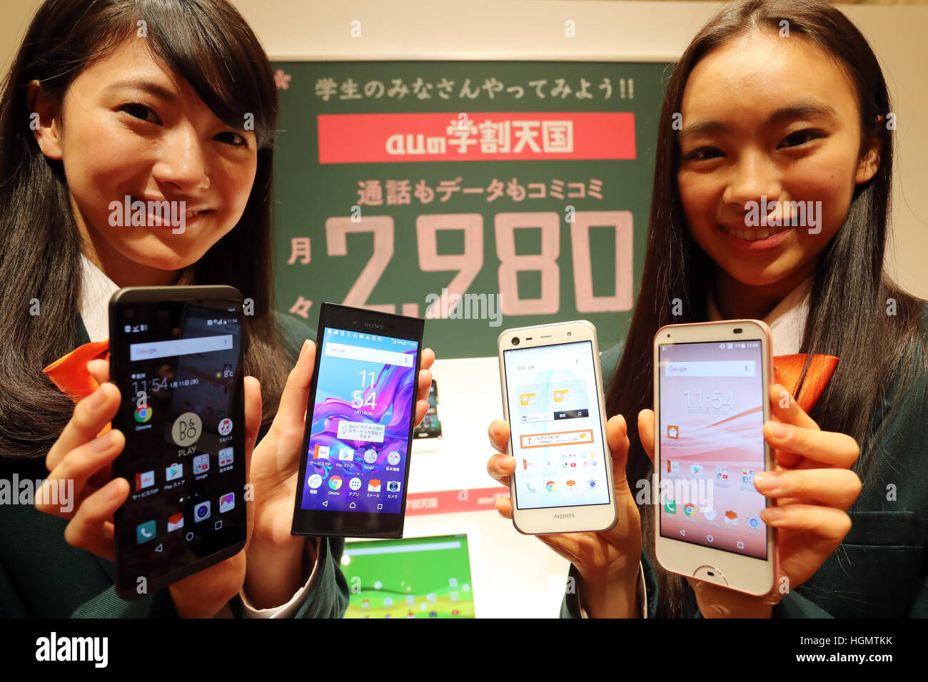 Tokyo, Japan. 11th Jan, 2017. Models display the new smart phone line ...