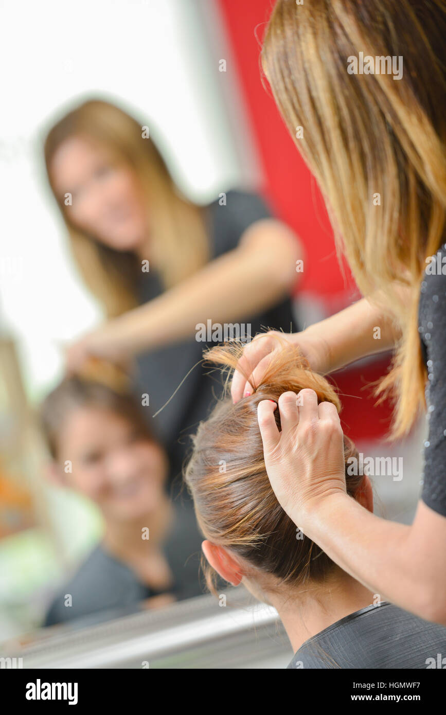Having her hair done Stock Photo - Alamy